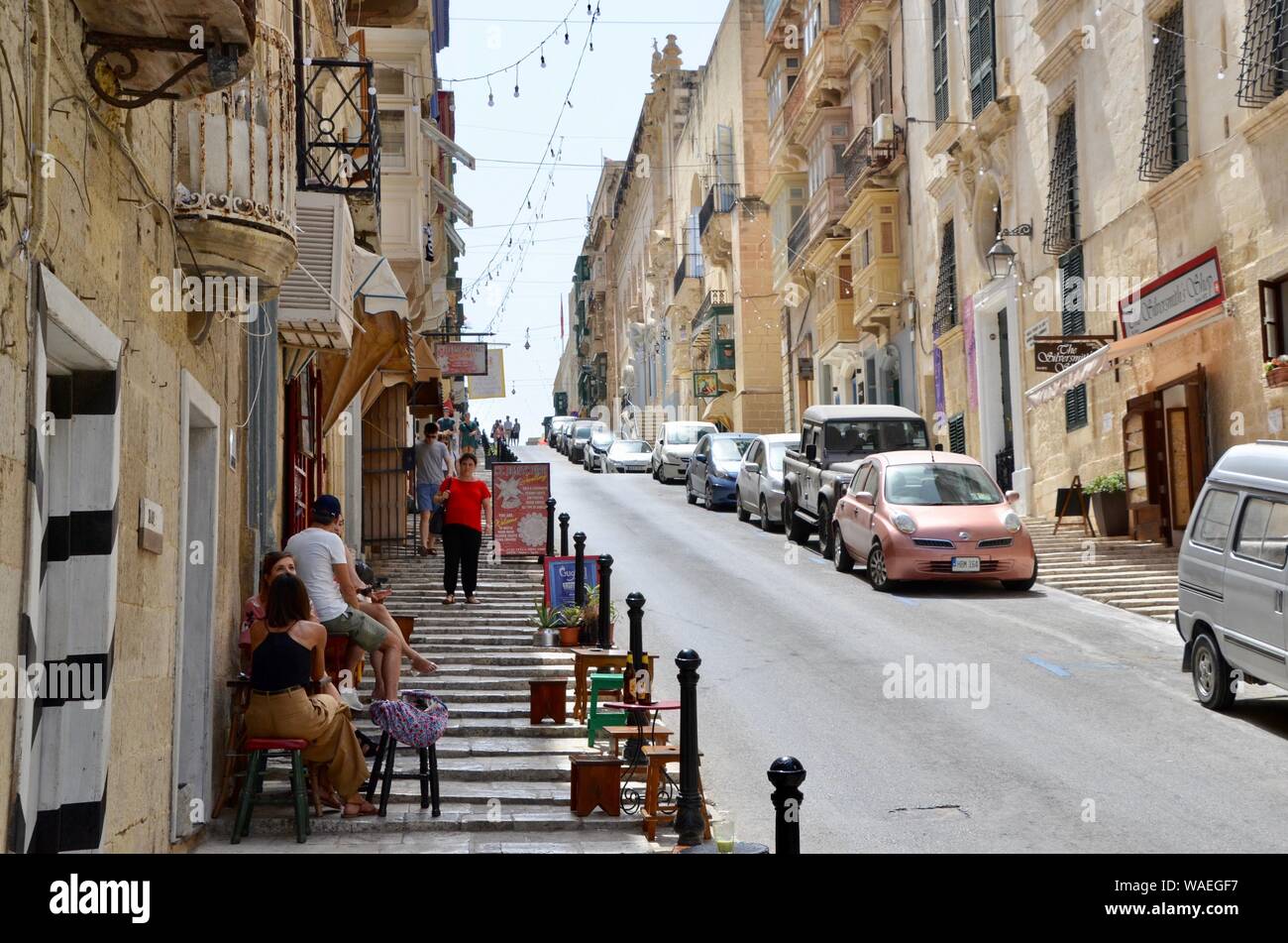 patrons drinking outside gugar bar in valletta malta Stock Photo - Alamy