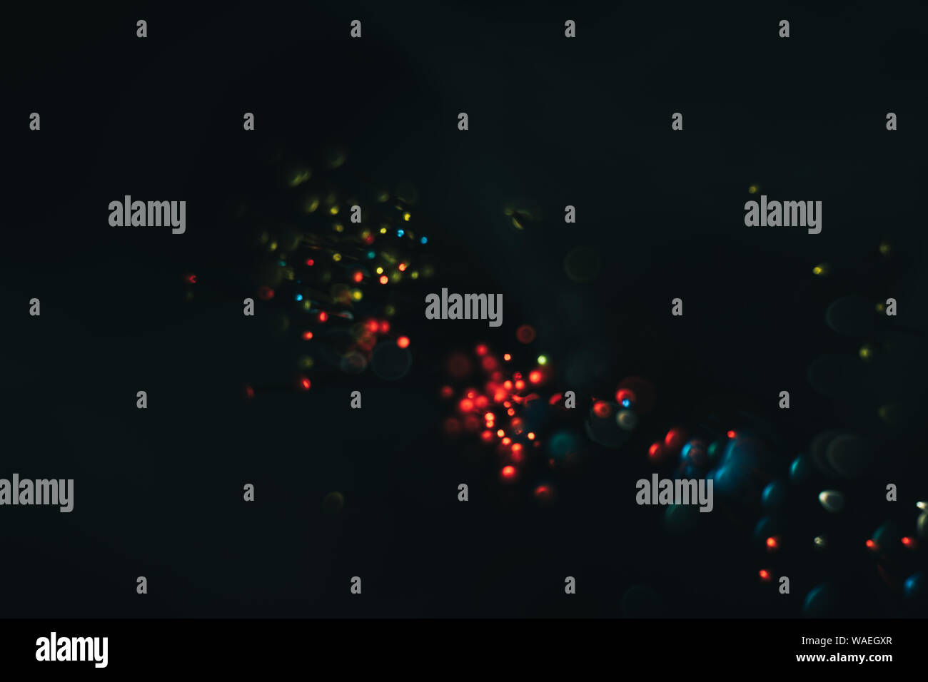 Beautiful multi colored bokeh background on a dark Stock Photo - Alamy