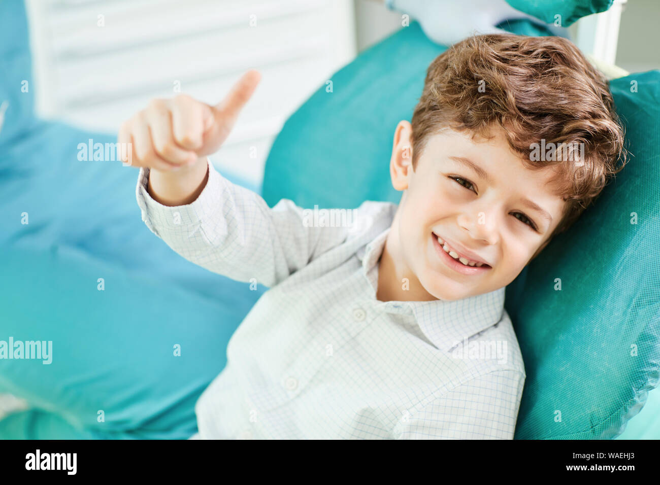 The boy smiles raised his thumb up Stock Photo - Alamy