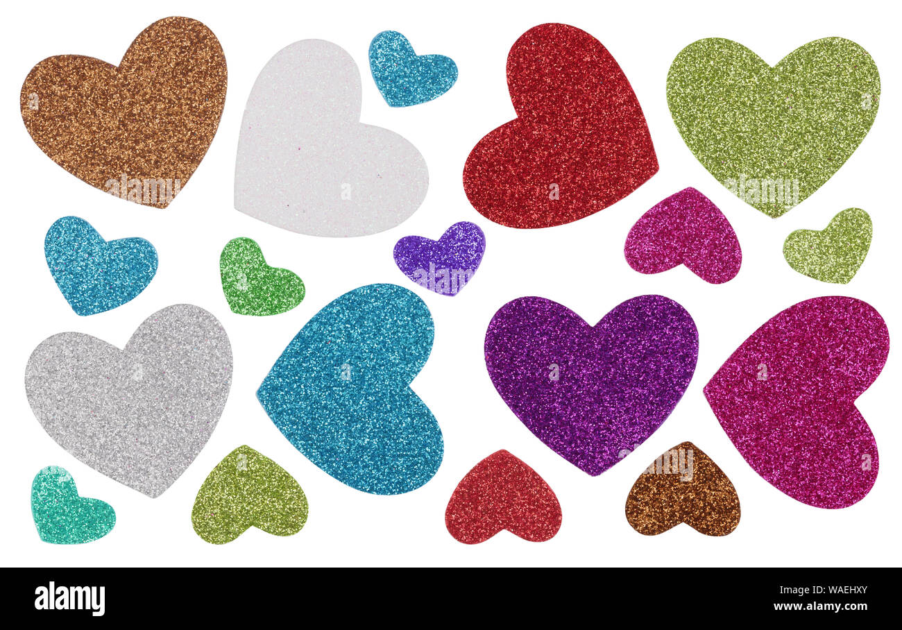 A handmade small multi-colored paper hearts is strewn with sparkles and ...