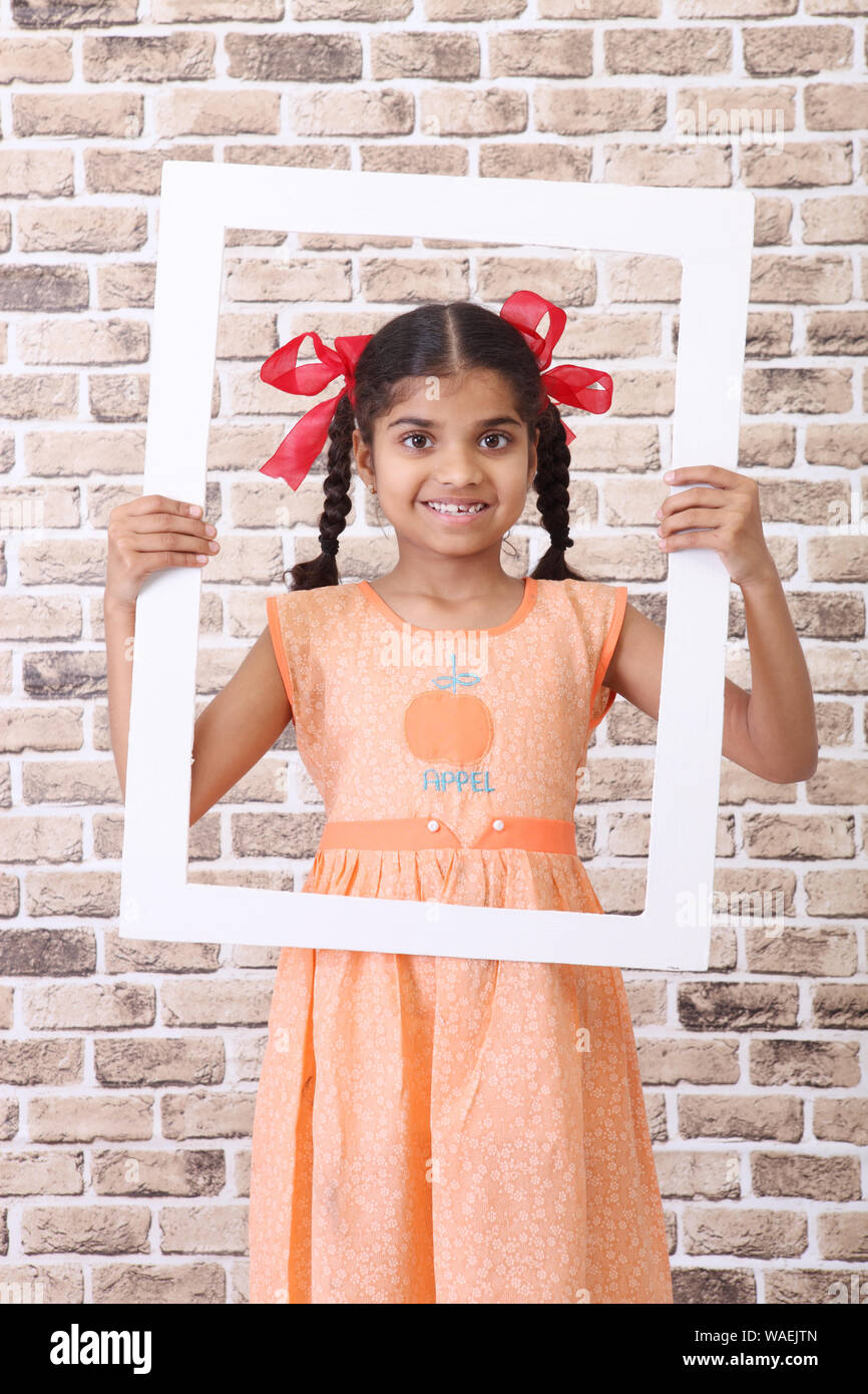 Child holding picture frame hi-res stock photography and images - Alamy