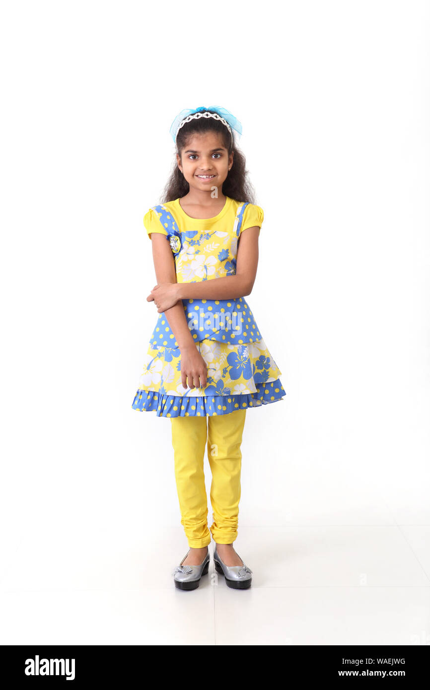 Girl standing and smiling Stock Photo - Alamy