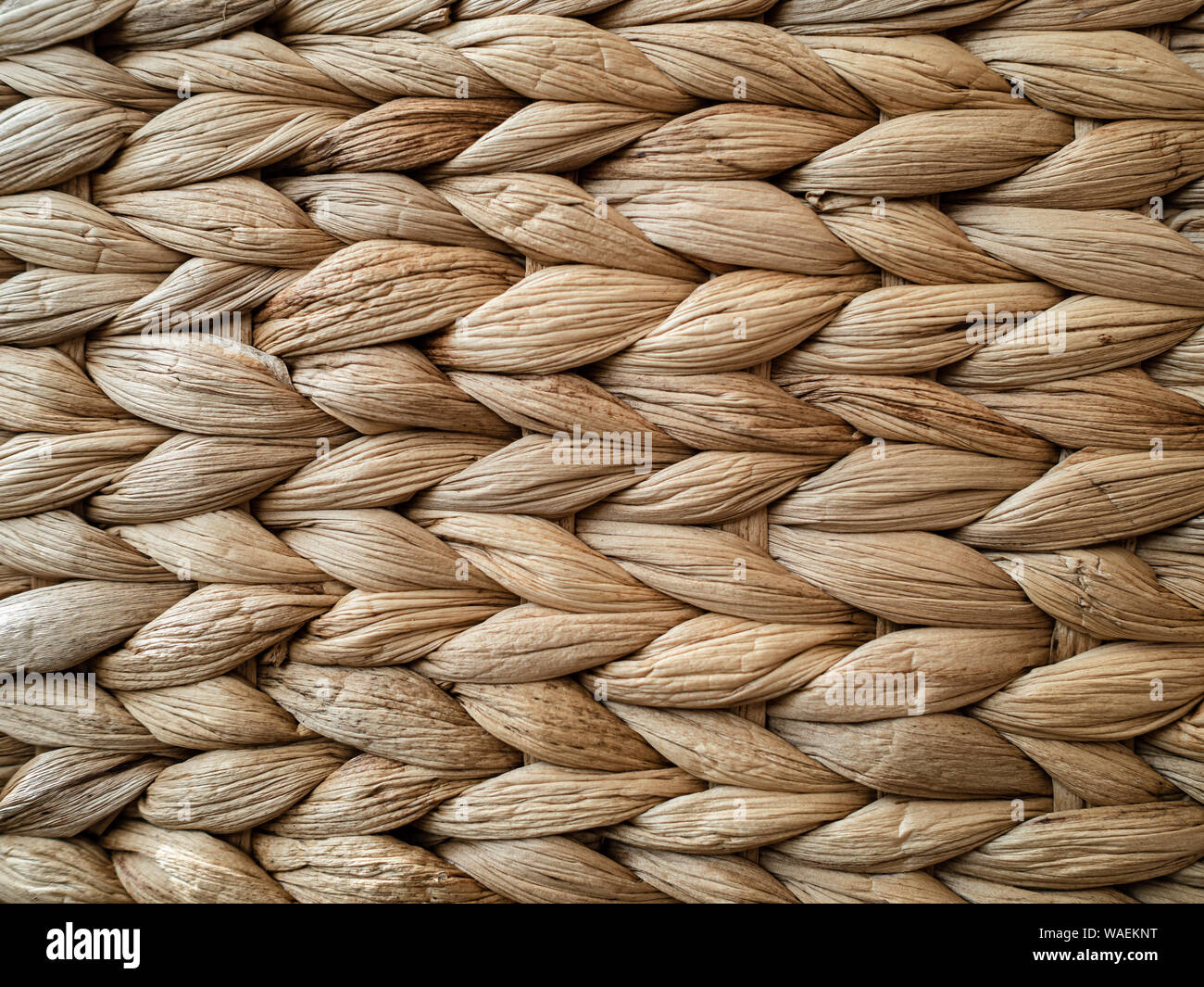 Light brown heavily textured abstract background of raffia wicker Stock ...