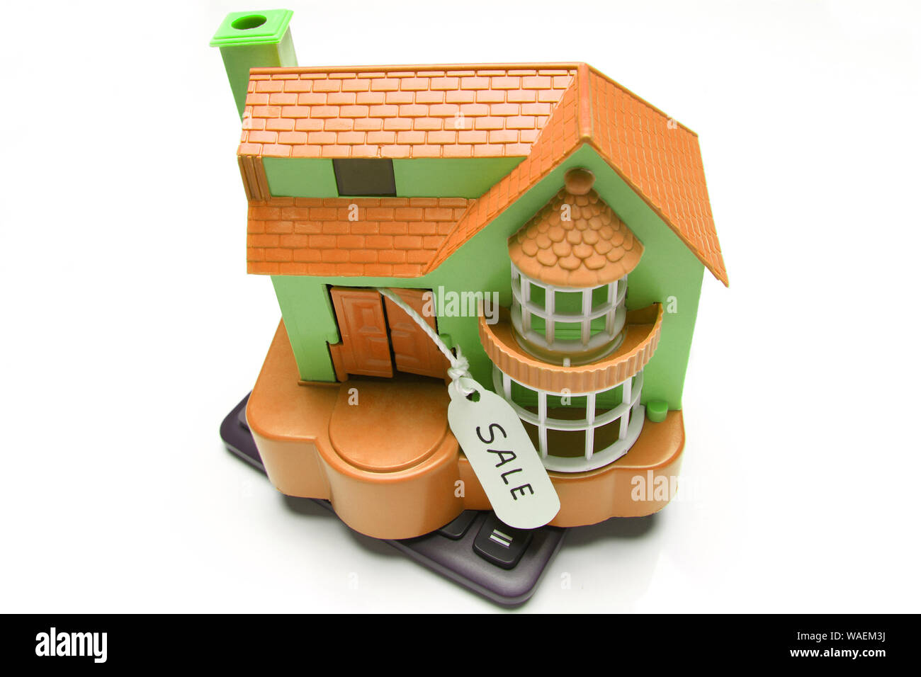 Calculator house model Cut Out Stock Images & Pictures - Alamy