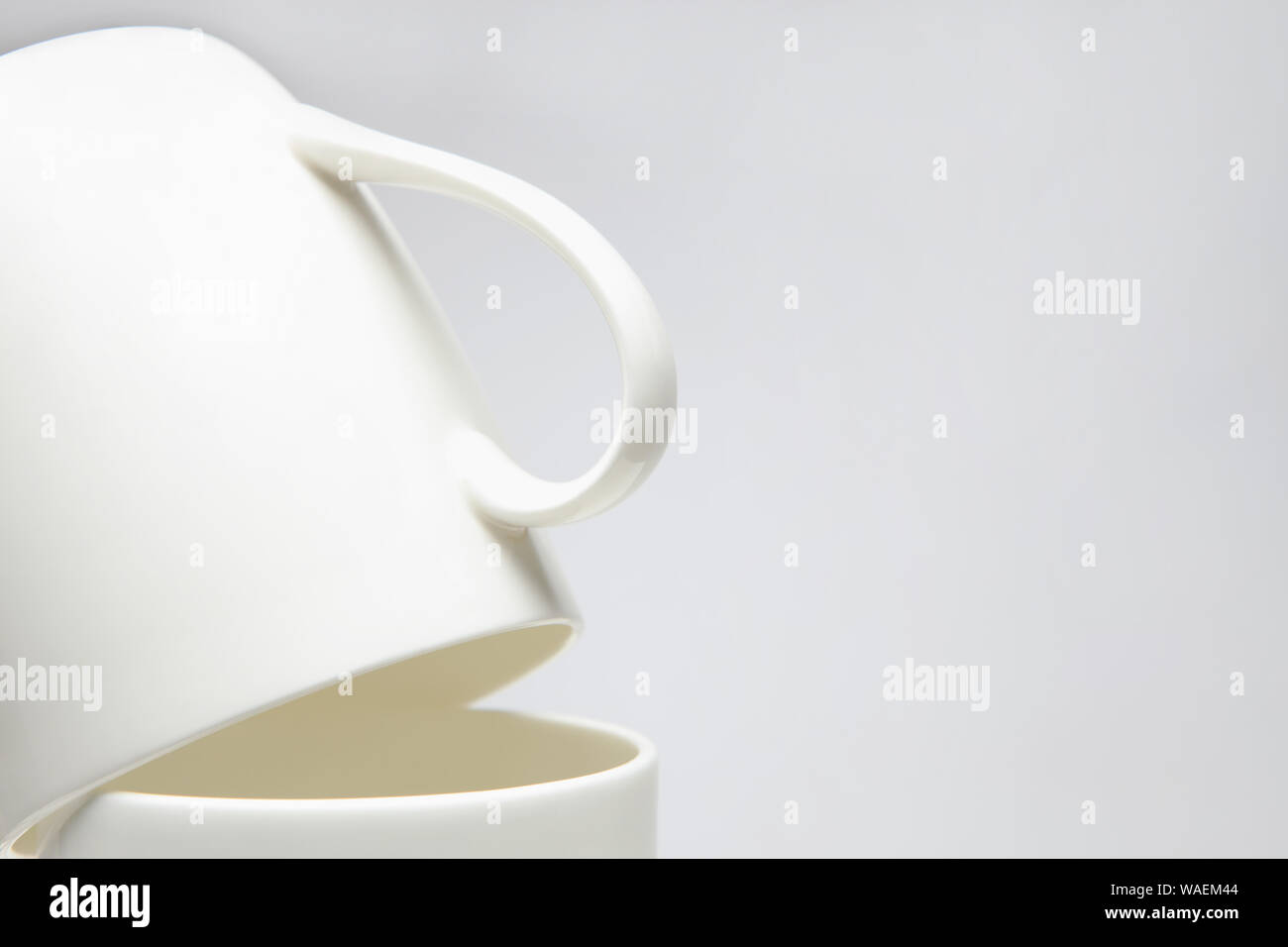 Cups representing human face Stock Photo - Alamy