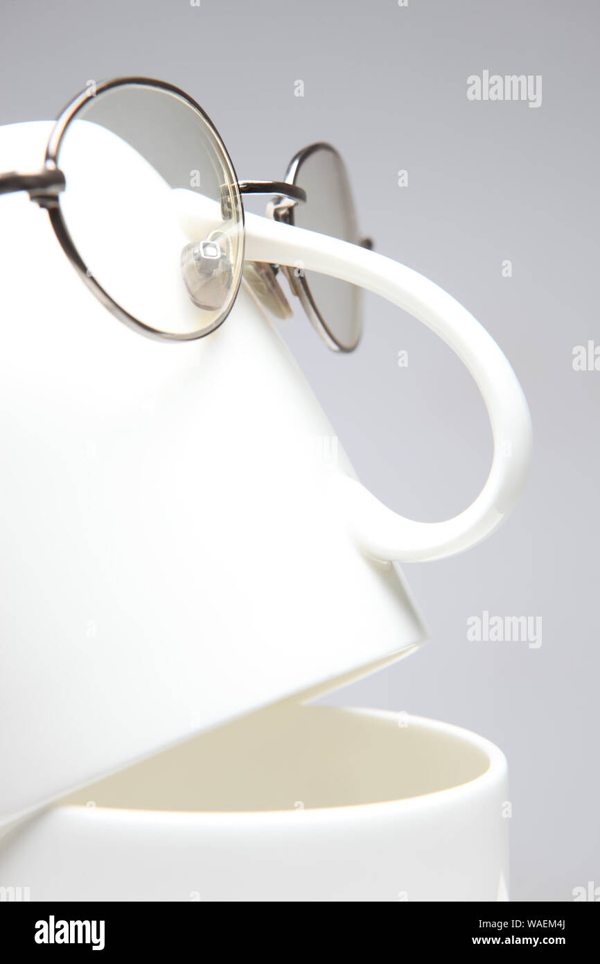 Cups representing human face Stock Photo - Alamy