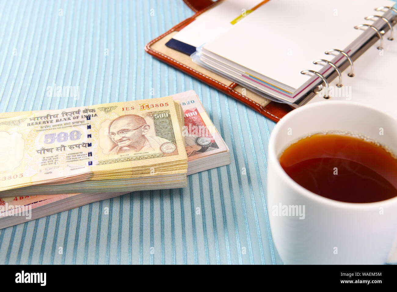 Budget planning with tea Stock Photo - Alamy