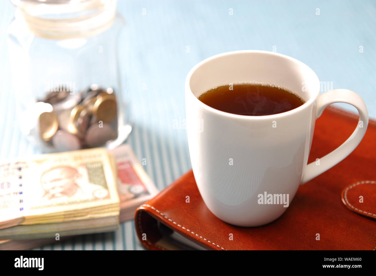 Budget planning with tea Stock Photo - Alamy
