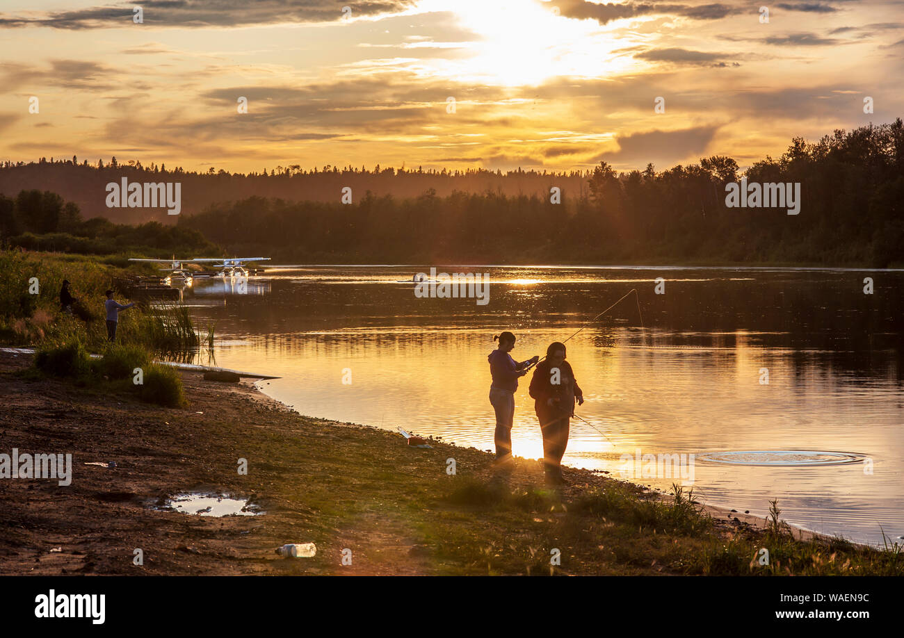 Locals fishing on the Snye River in Fort McMurray, Alberta, Canada ...