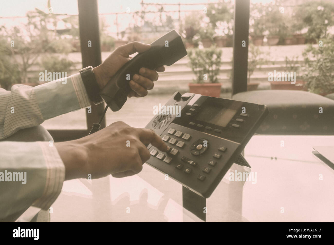 Person using rotary dial phone hi-res stock photography and images - Alamy