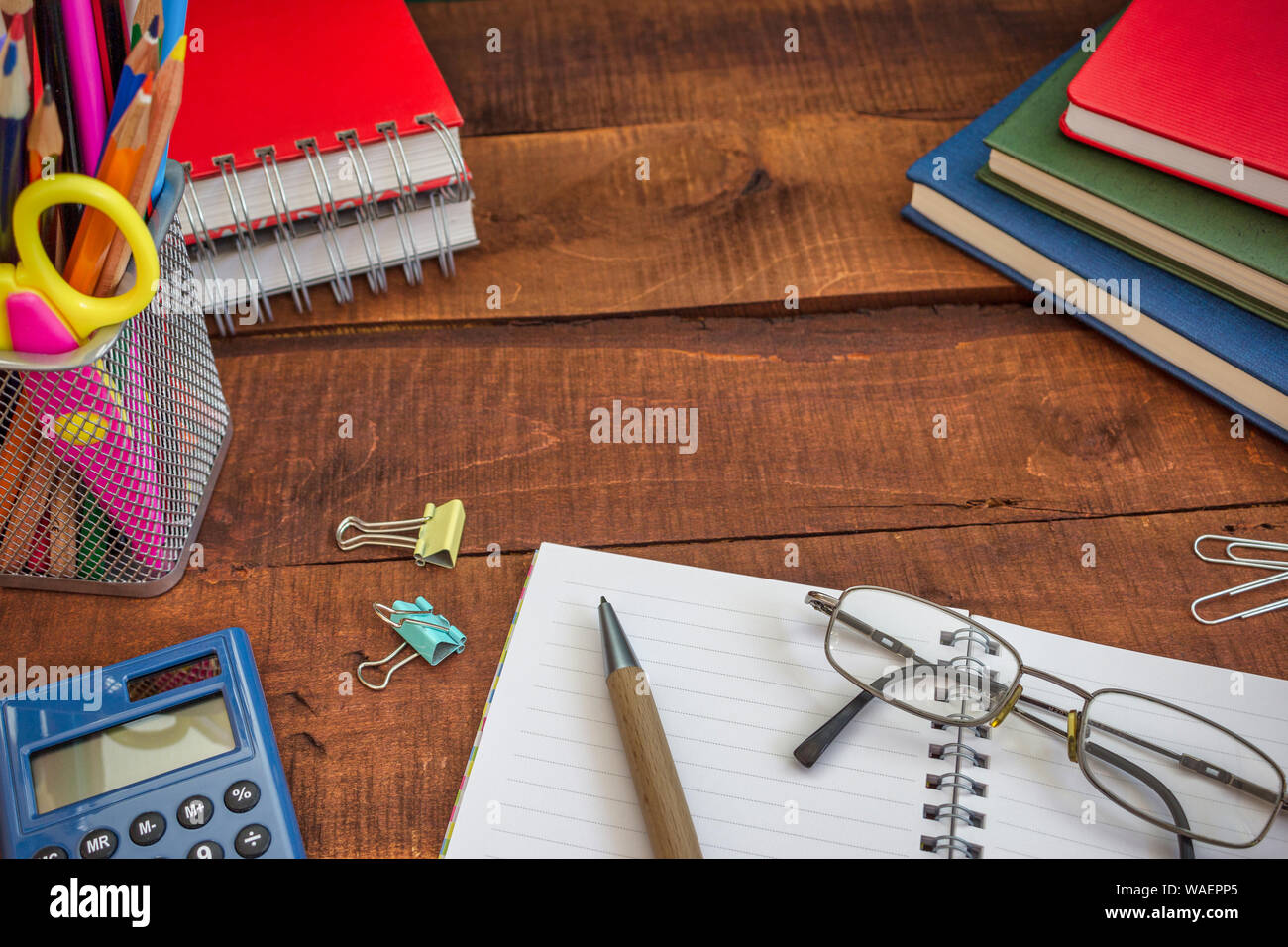 School supplies on wooden table. Back to school background with copy ...