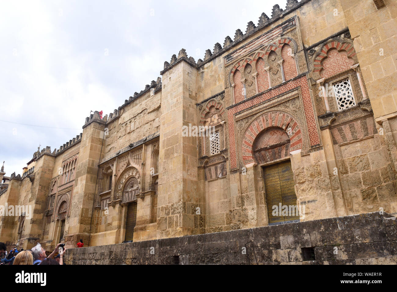 Tourists front of facade of San Ildefonso and Postigo de Palacio ...