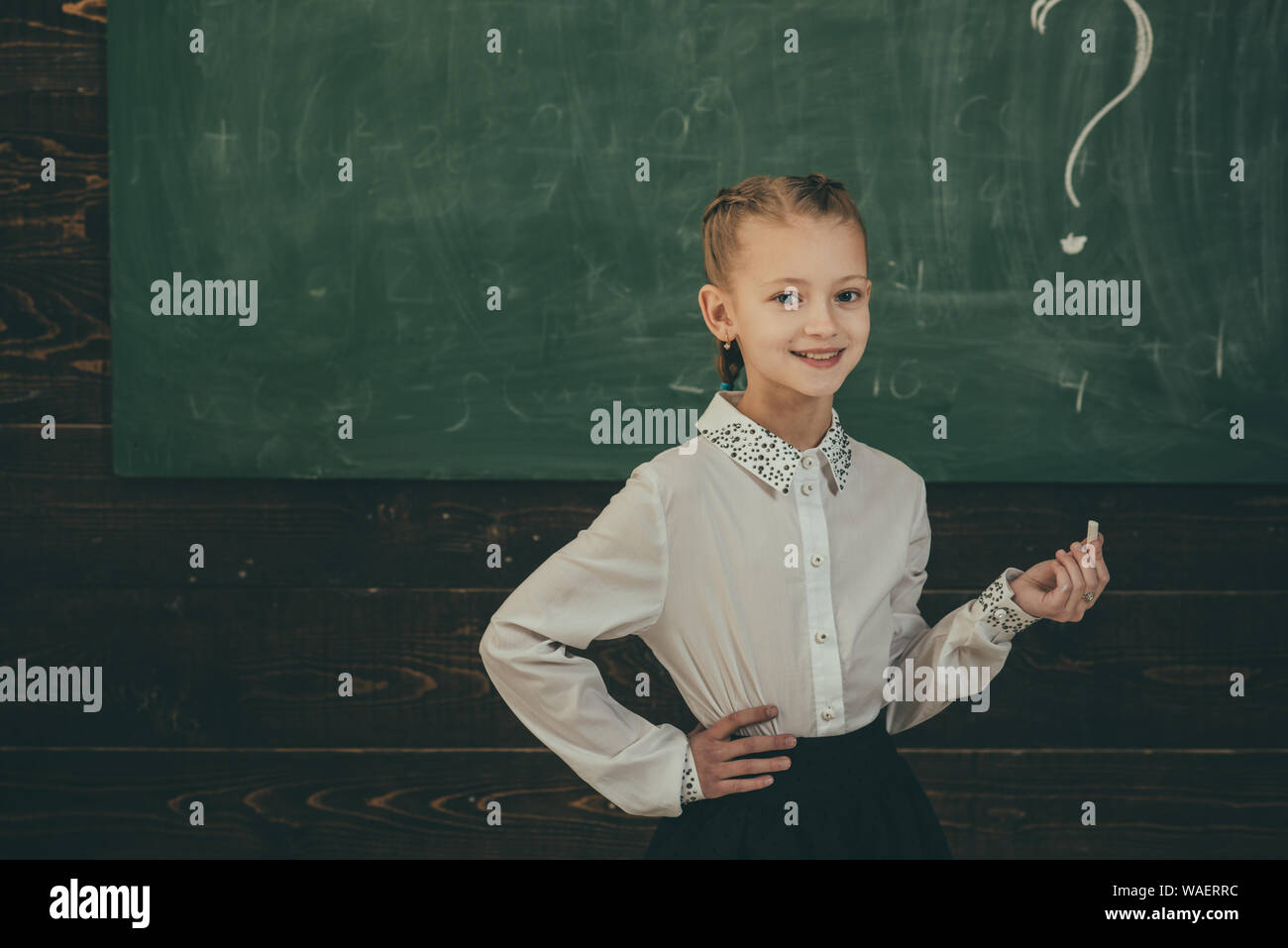 solution. problem solution at school. smiling little girl wrote ...