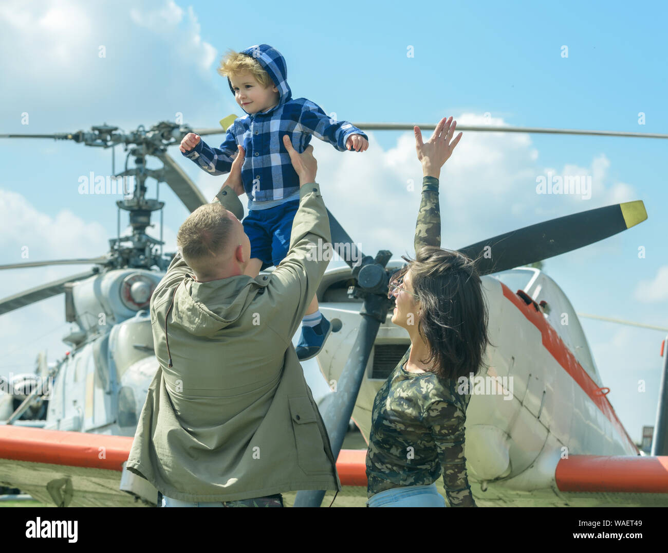Father and fathers day. Father raise son high in air on fathers day ...