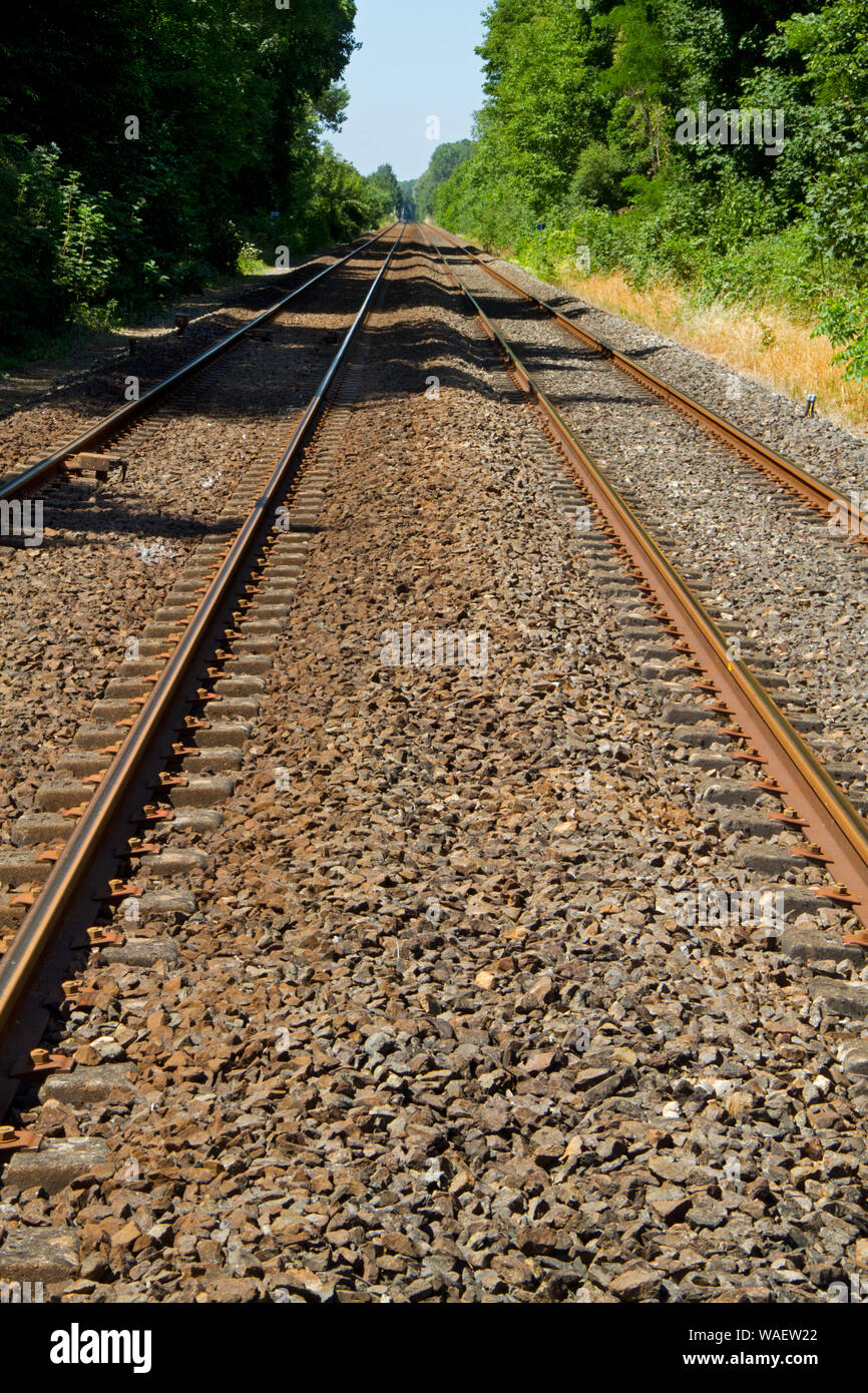Railroad tracks on concrete sleepers and ballast bed Stock Photo - Alamy