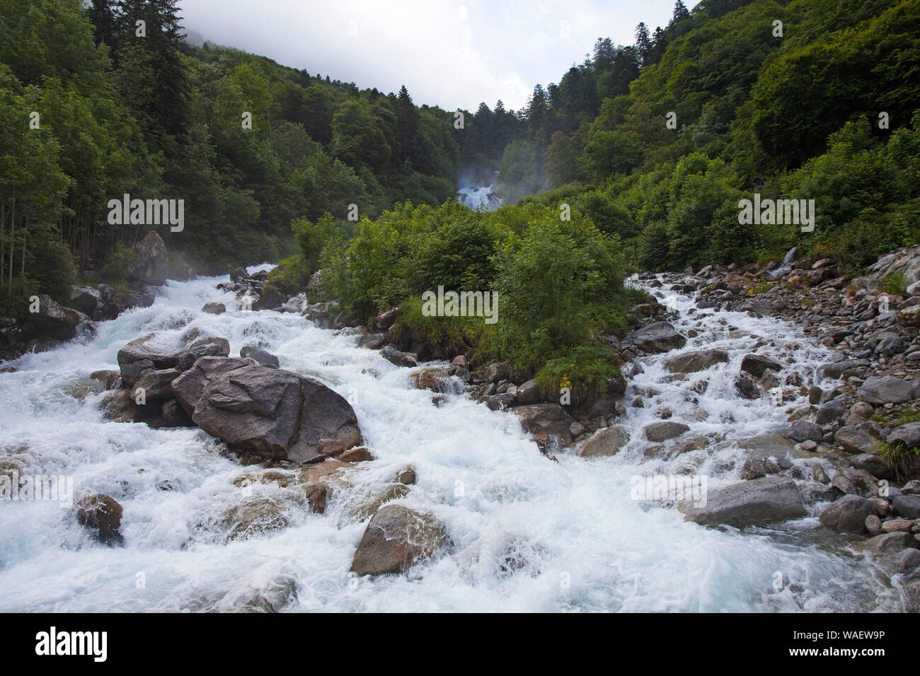 Waterfall and rushing river of the Gave de Lutour from l'Abri du ...