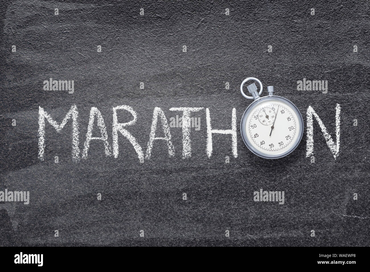 marathon word written on chalkboard with vintage precise stopwatch used ...