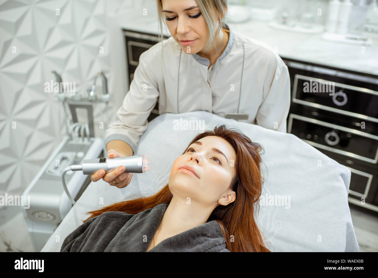 Female Cosmetologist Making Oxygen Mesotherapy To A Woman At The Luxury
