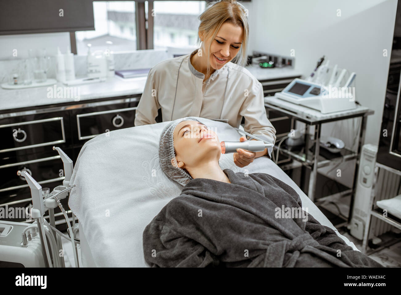 Female Cosmetologist Making Oxygen Mesotherapy To A Woman At The Luxury