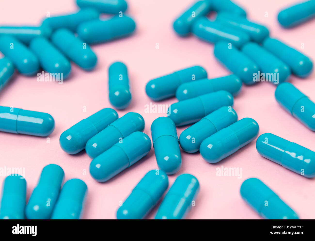 Blue pills on pink background. Template for feminine beauty blog social ...