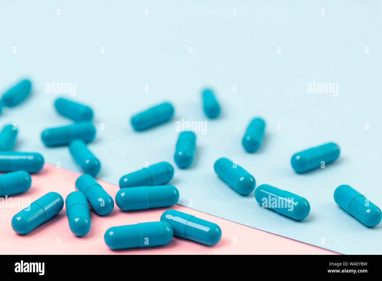 Blue pills on pink background. Template for feminine beauty blog social ...