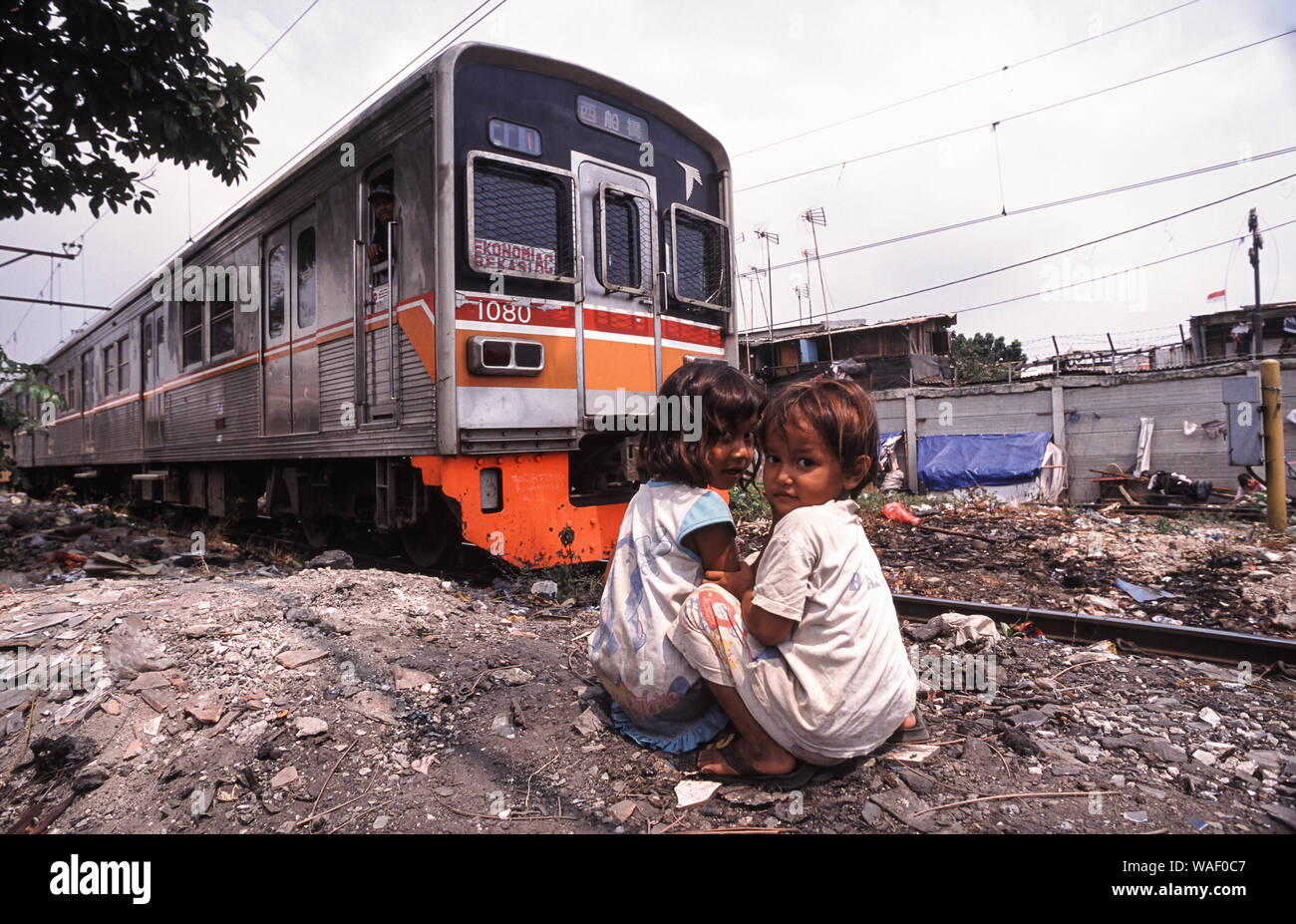 08.08.2009, Jakarta, Java, Indonesia, Asia - Two little girls squat ...