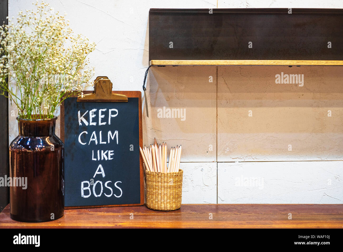 Keep Calm like a Boss hand drawing with chalk on blackboard on working ...