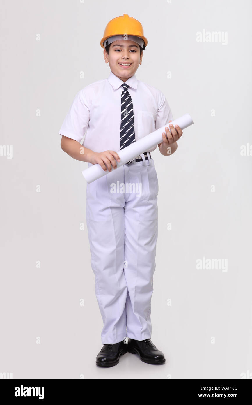 Boy pretending to be an architect and holding a blueprint Stock Photo ...