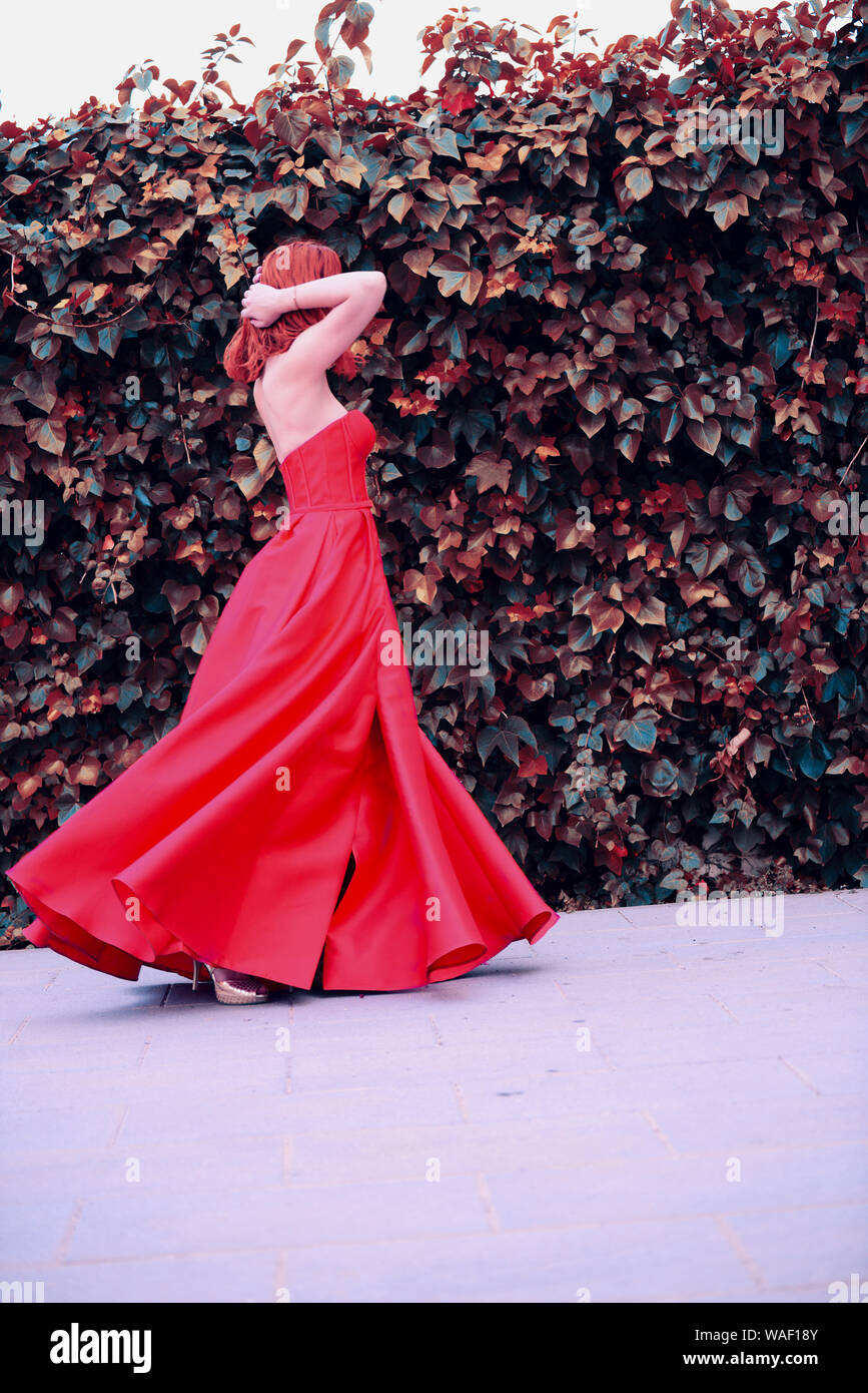 Beautiful Young Woman wearing red dress Stock Photo - Alamy