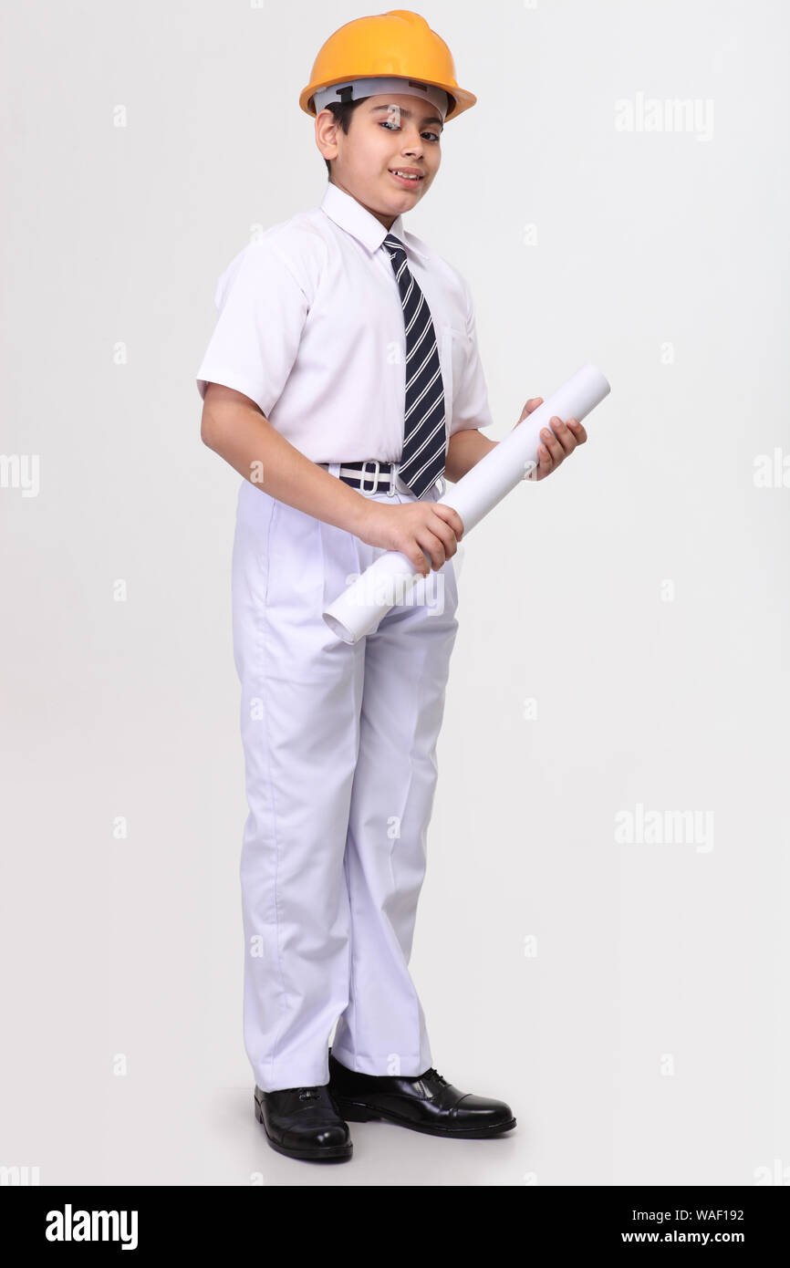 Boy pretending to be an architect and holding a blueprint Stock Photo ...