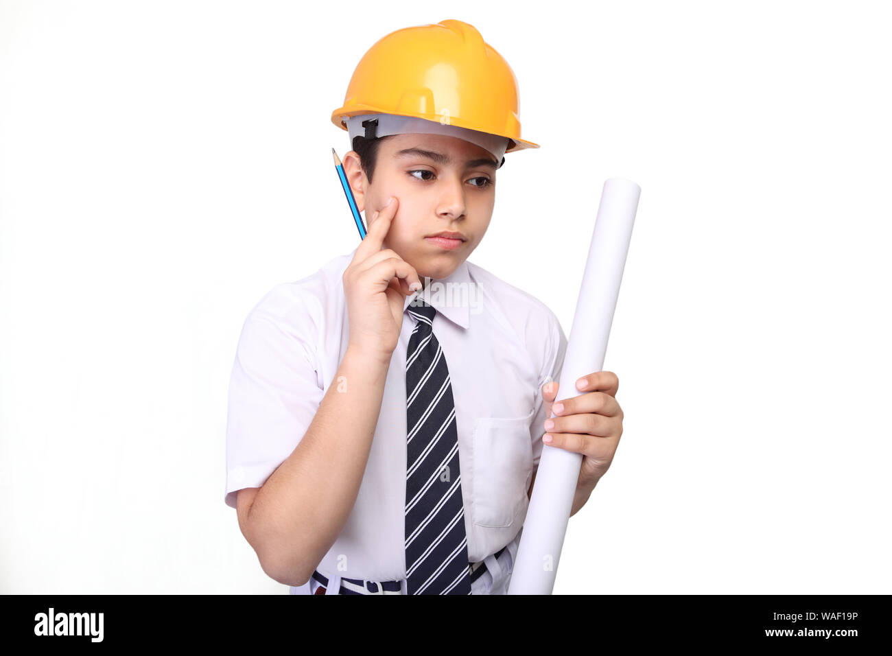 Boy pretending to be an architect and holding a blueprint Stock Photo ...