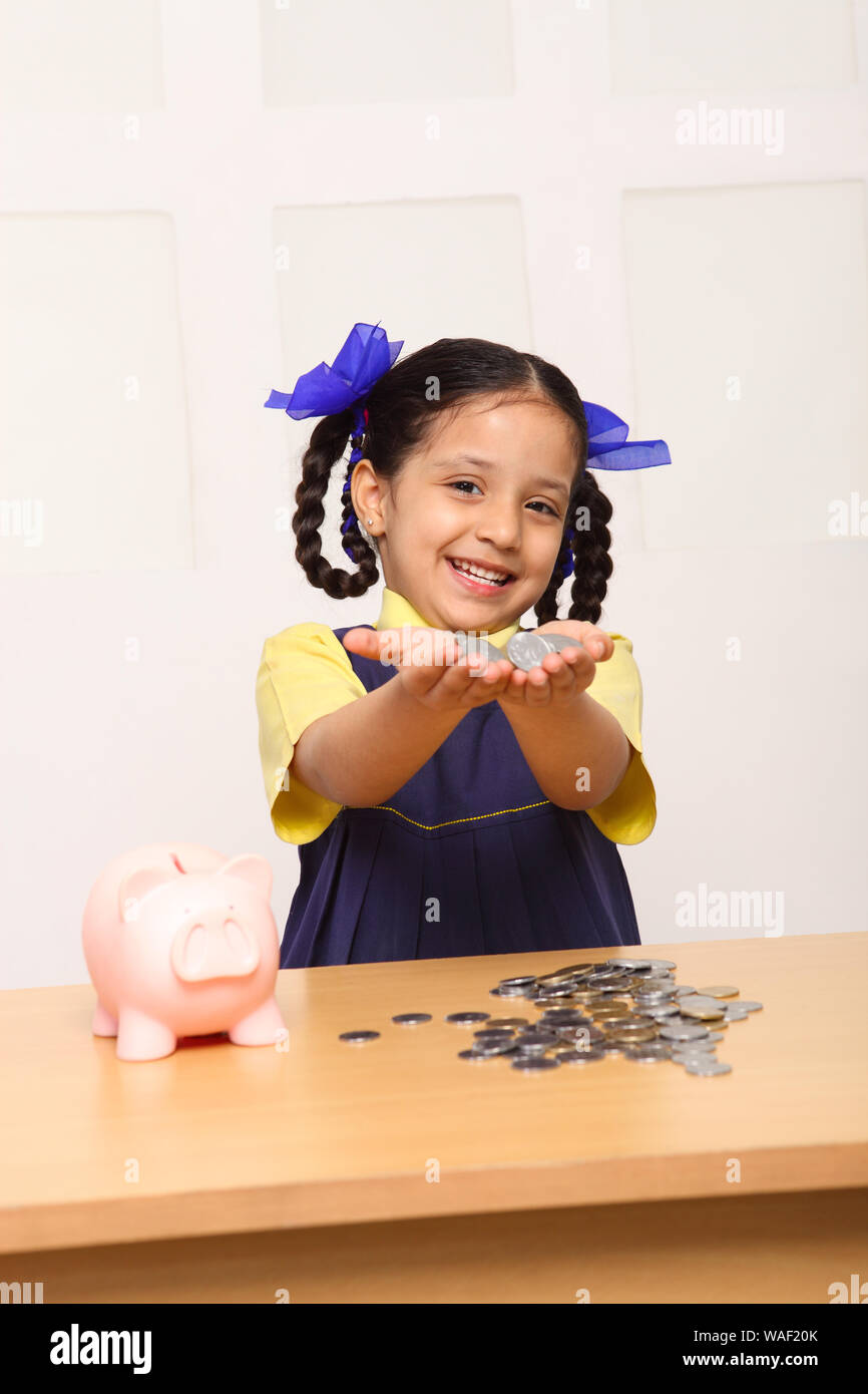 Schoolgirl showing her pocket money Stock Photo - Alamy