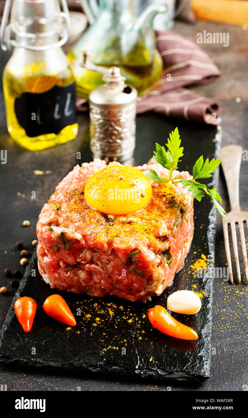 fresh tartar with spice and yolk, meat tartar Stock Photo - Alamy