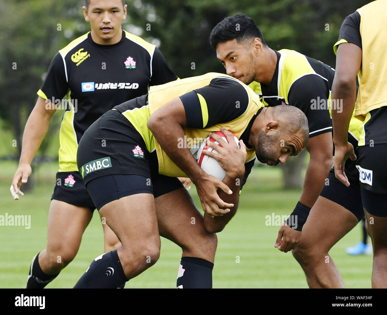 Japan rugby players, led by captain Michael Leitch (C), train in Abashiri, Hokkaido, on Aug. 20 ...