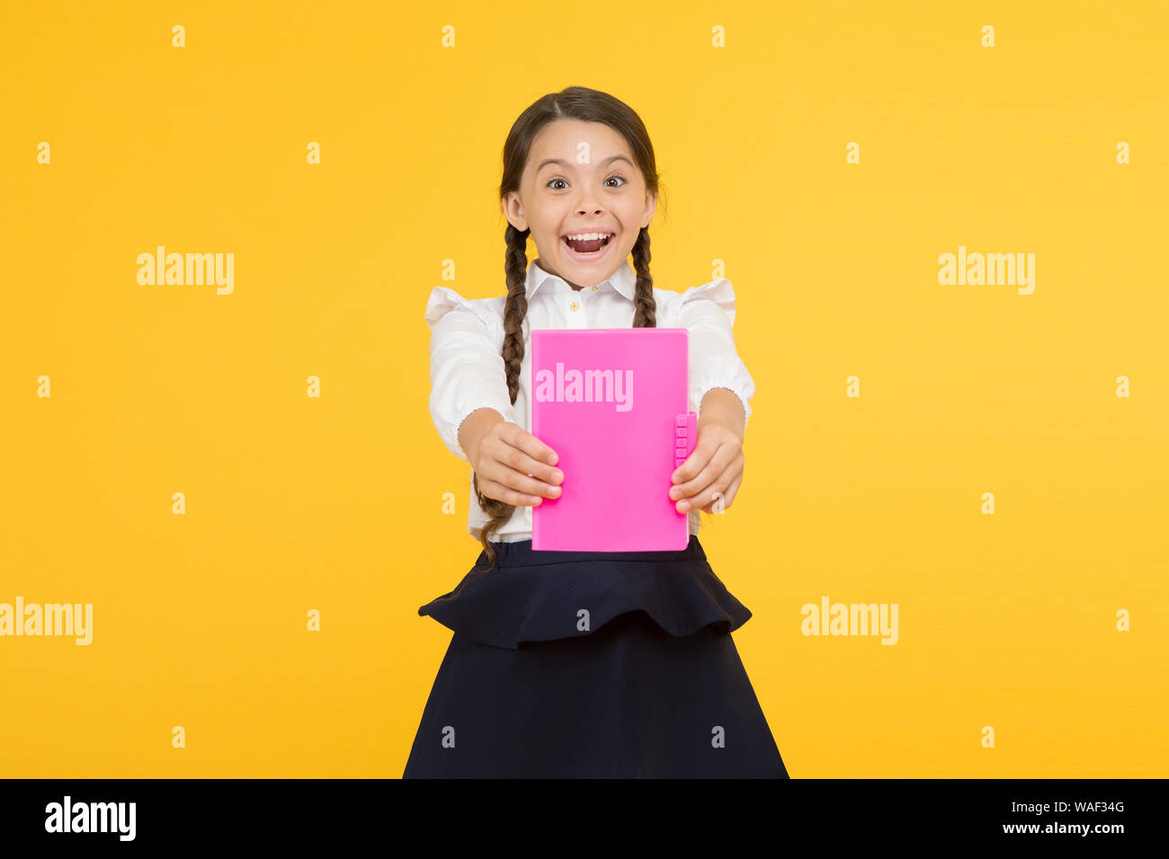 best book. small girl in school uniform. reading story. childrens ...