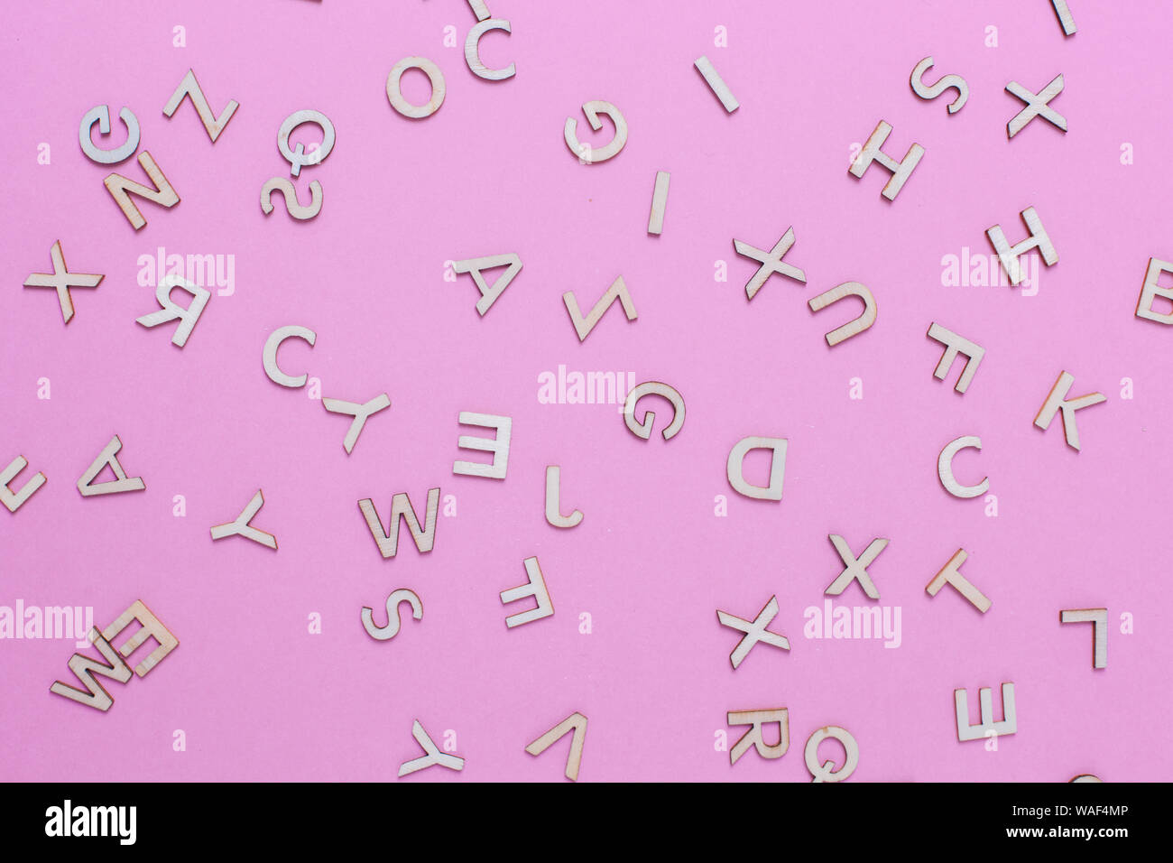 Wooden ABC alphabet letters on pink background Stock Photo - Alamy