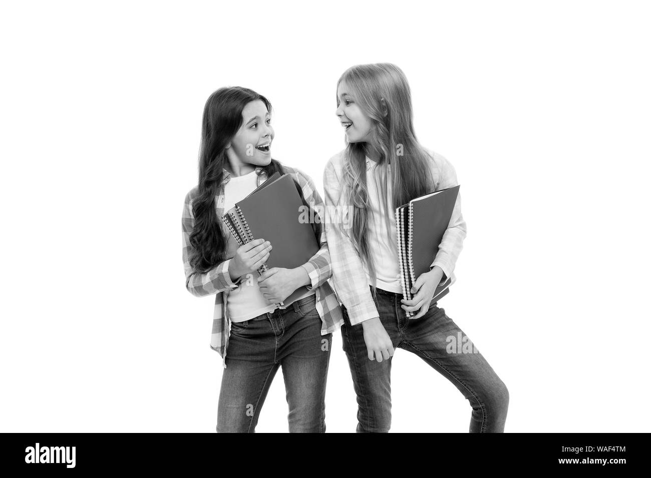 School stationery. Pupils carrying big textbooks to school classes ...