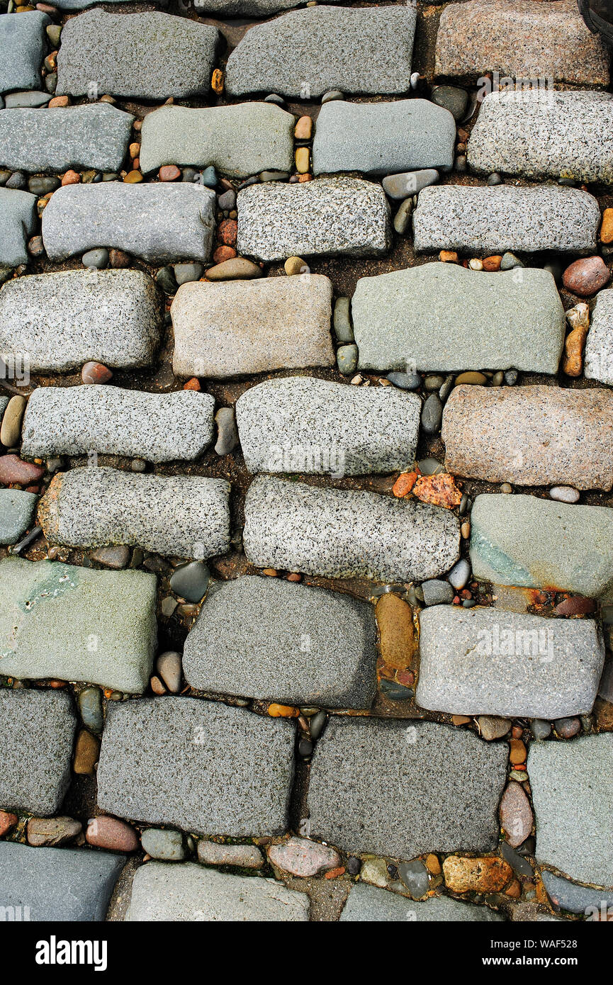 Large stones and small pebbles making up section of seawall Stock Photo ...