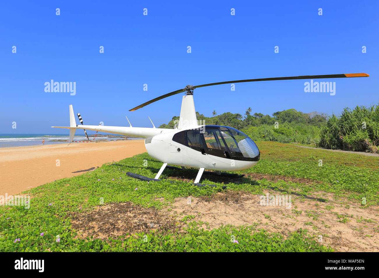 White helicopter on the beach Stock Photo - Alamy
