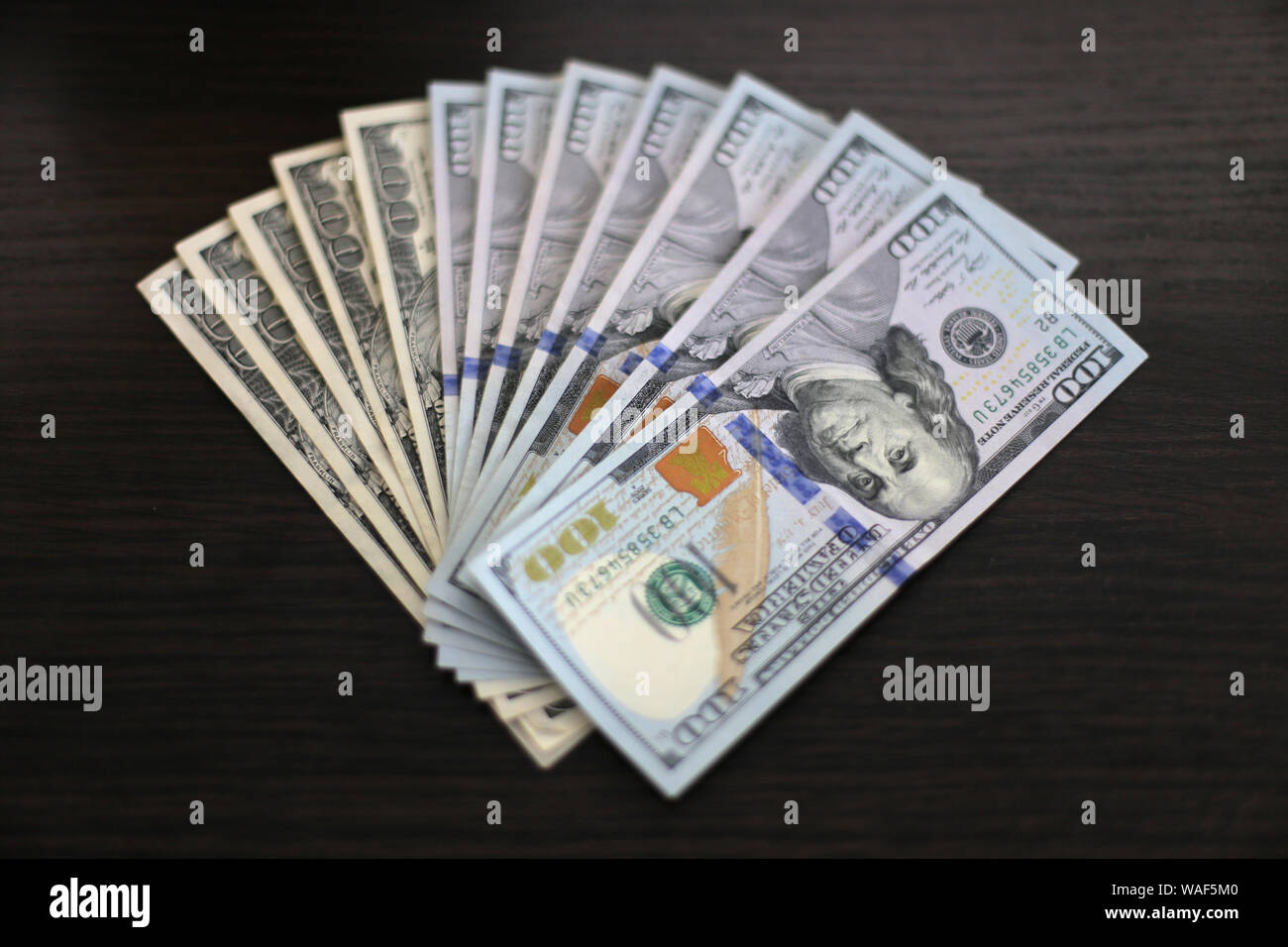 Banknotes hundred dollars on the table Stock Photo - Alamy