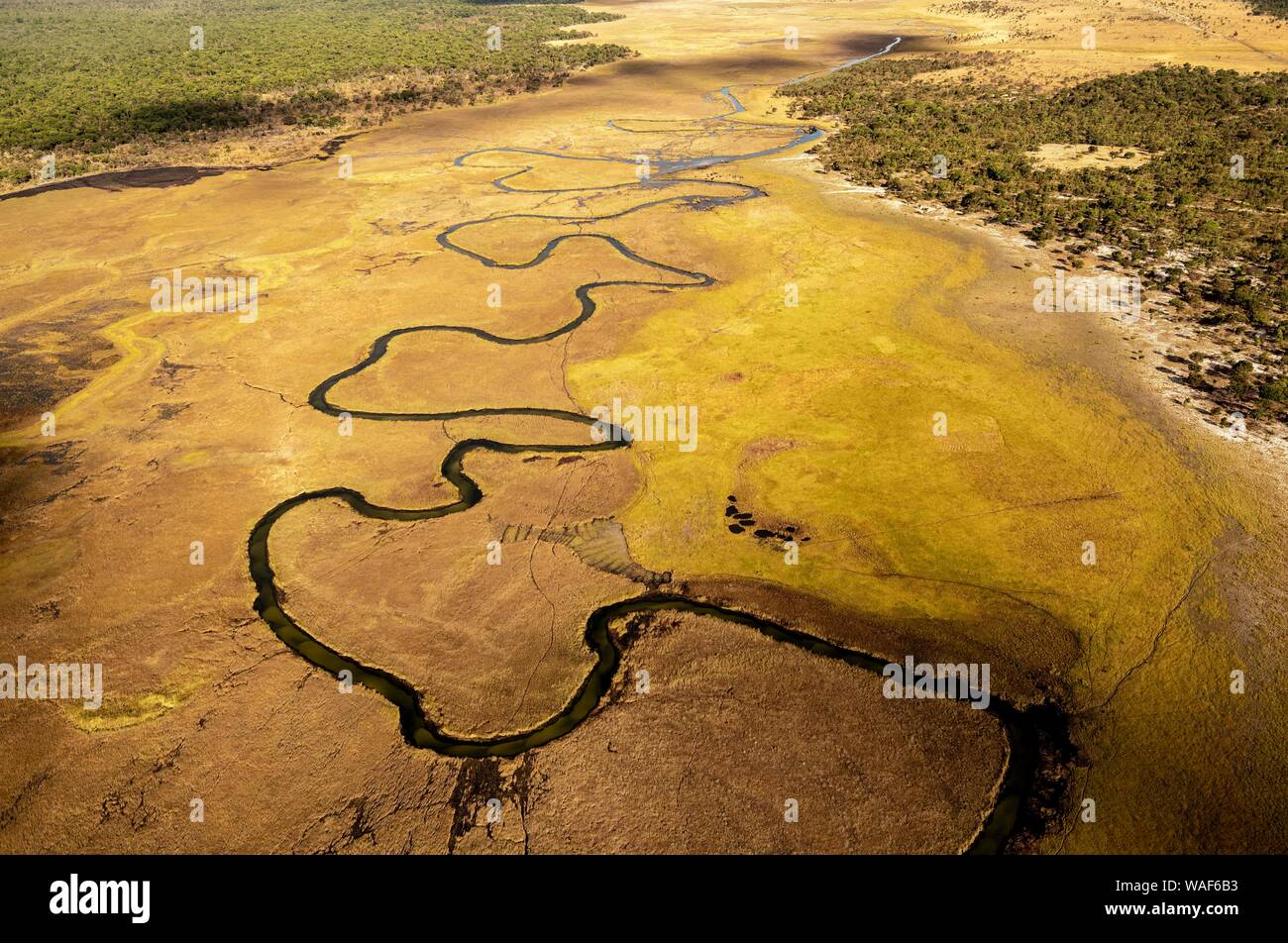 Aerial view, Cubango river meanders through grass savannah, near Cuito Cuanavale, Cuando Cubango ...
