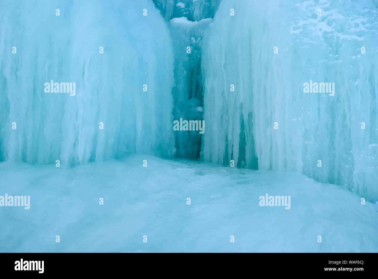 background - natural ice, section of glacier with icicles, frozen ...