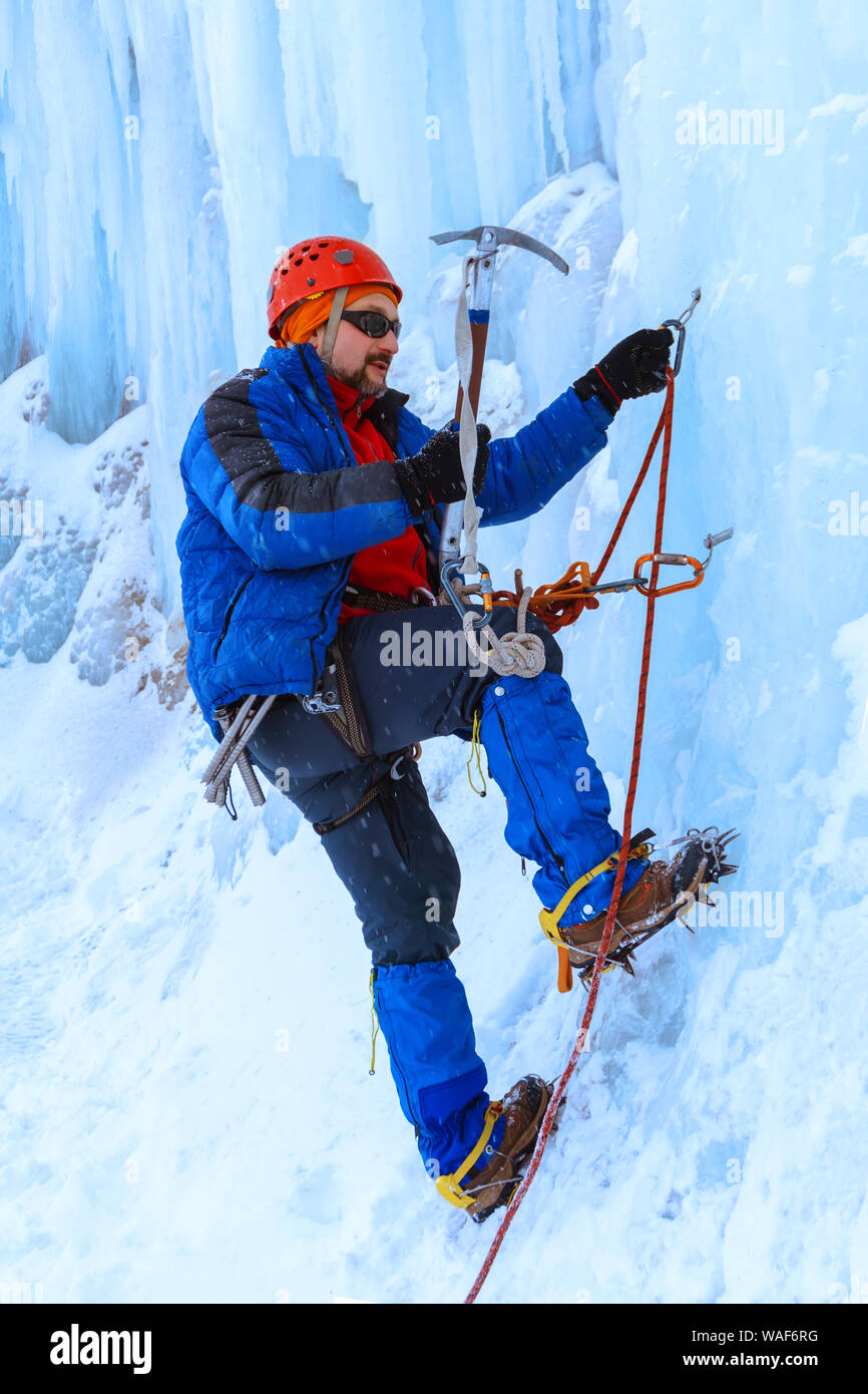 Man climbing vertical glacier ice hi-res stock photography and images ...