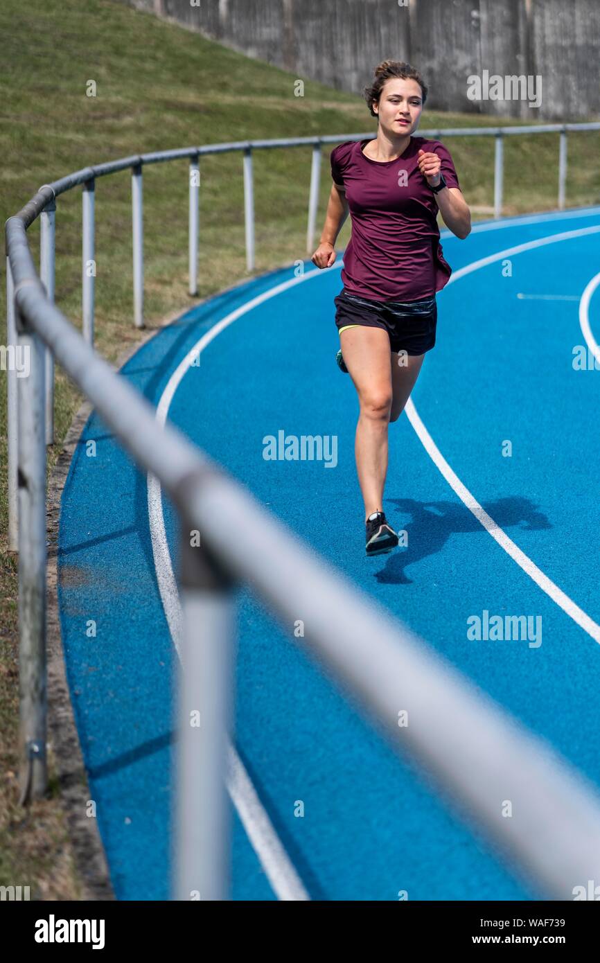 Athletics, woman sprinting in the curve, Germany Stock Photo - Alamy