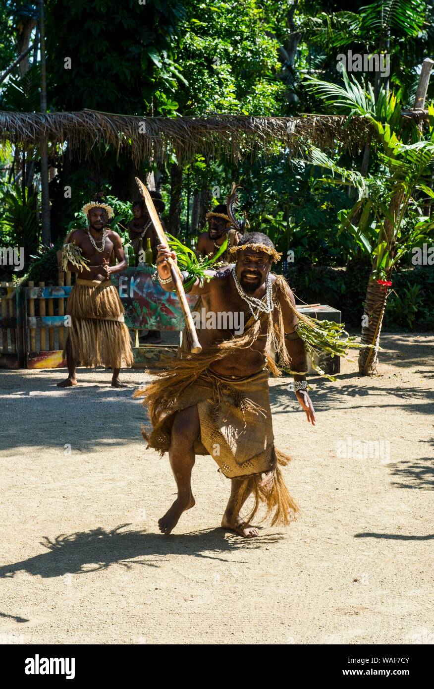 Man practising a traditional war ceremony, Ekasup cultural village ...