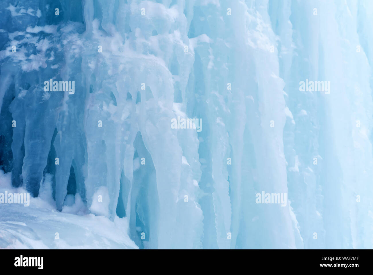 background - natural ice, section of glacier with icicles, frozen ...