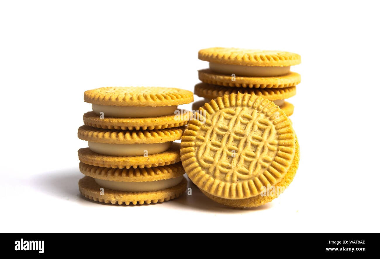 Golden biscuit sweet cookies isolated on white Stock Photo - Alamy