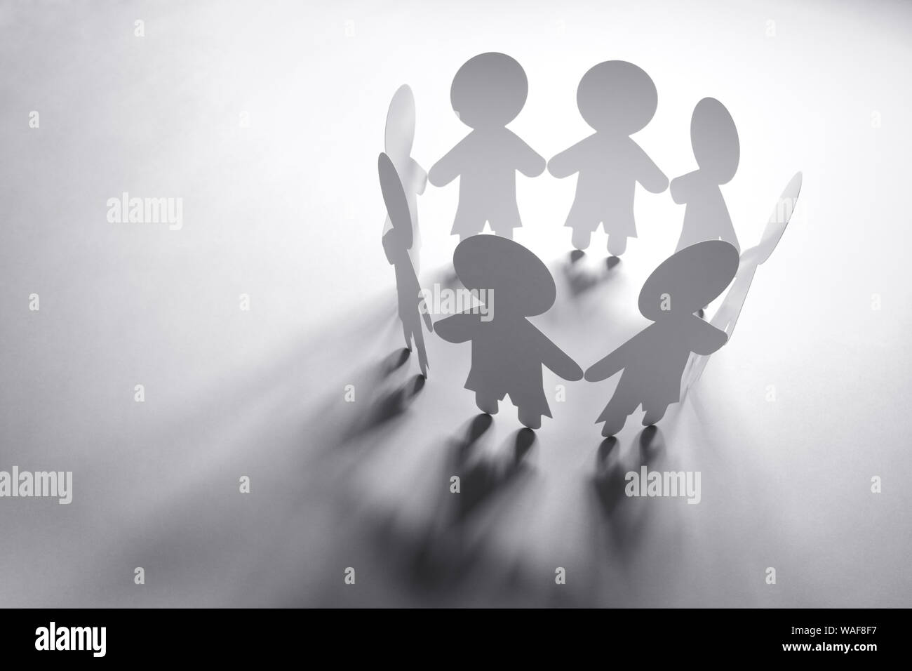 Circle of paper chain people hi-res stock photography and images - Alamy