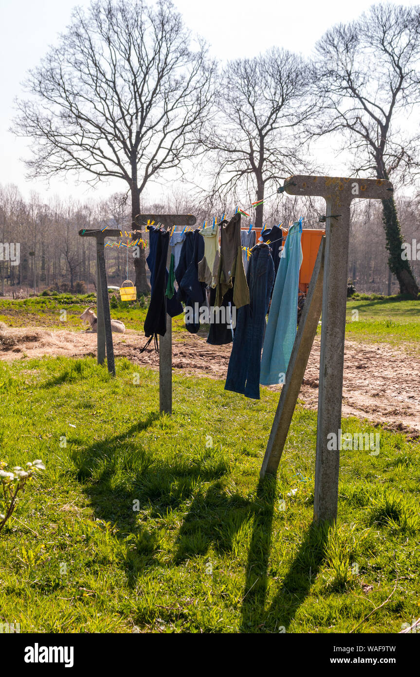 A rural washing line with clothes hanging to dry in Northern France ...