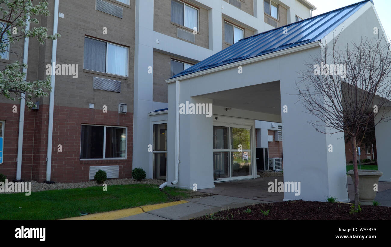 Typical day time exterior establishing shot close up of generic hotel ...